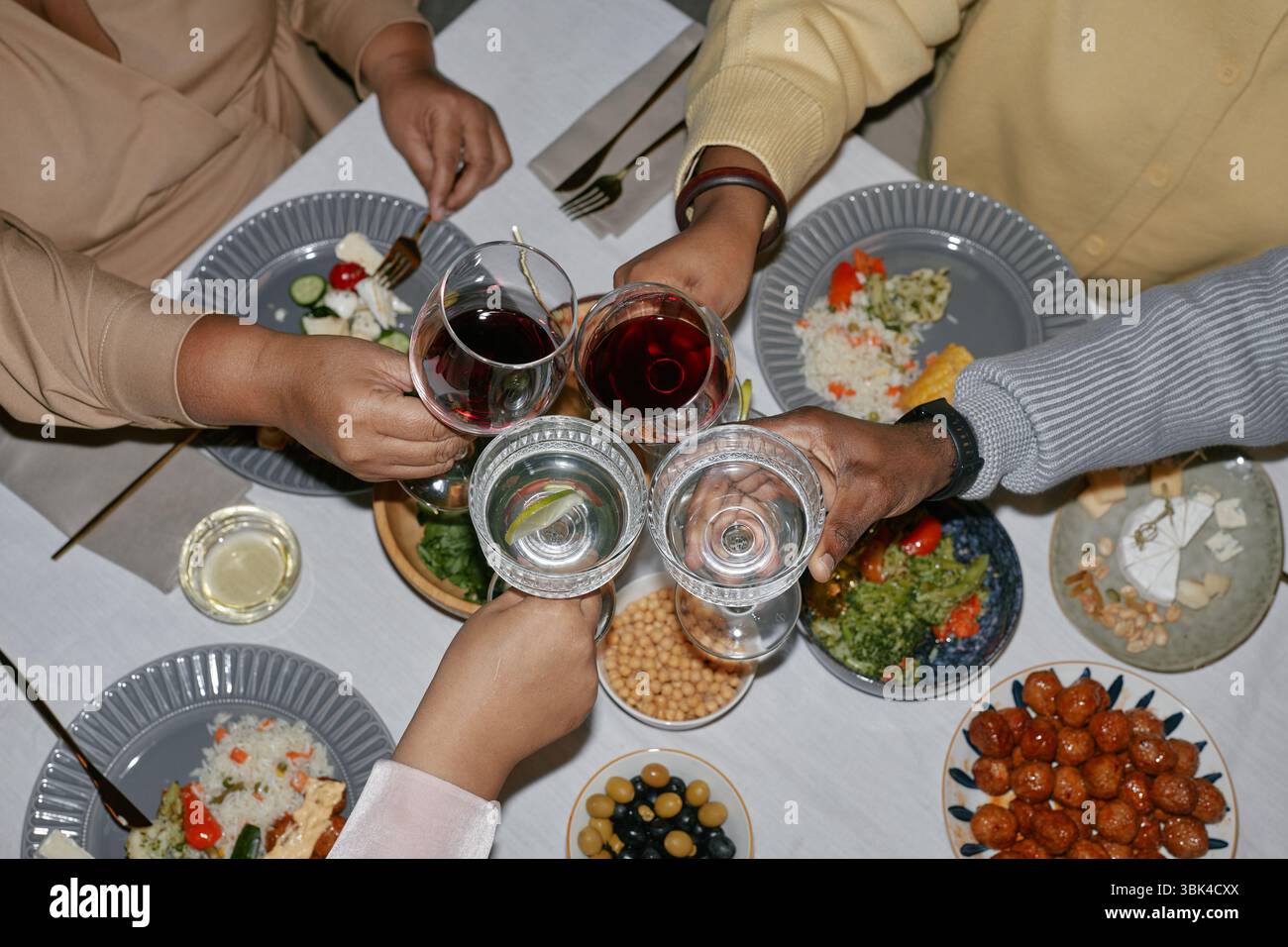 Top view people raising glasses hi-res stock photography and images - Alamy