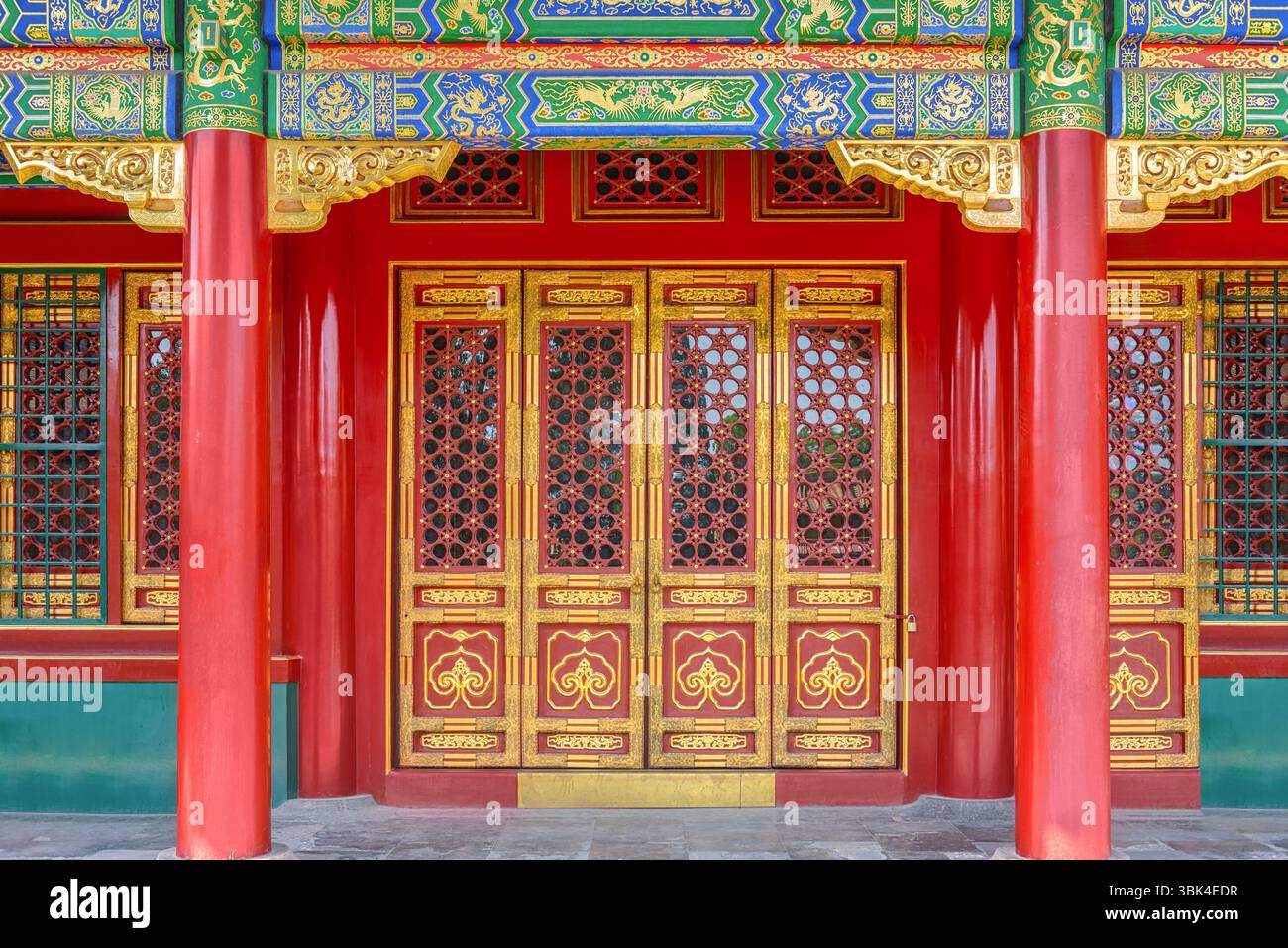 Gateway with red Chinese doors closeup photo Stock Photo - Alamy