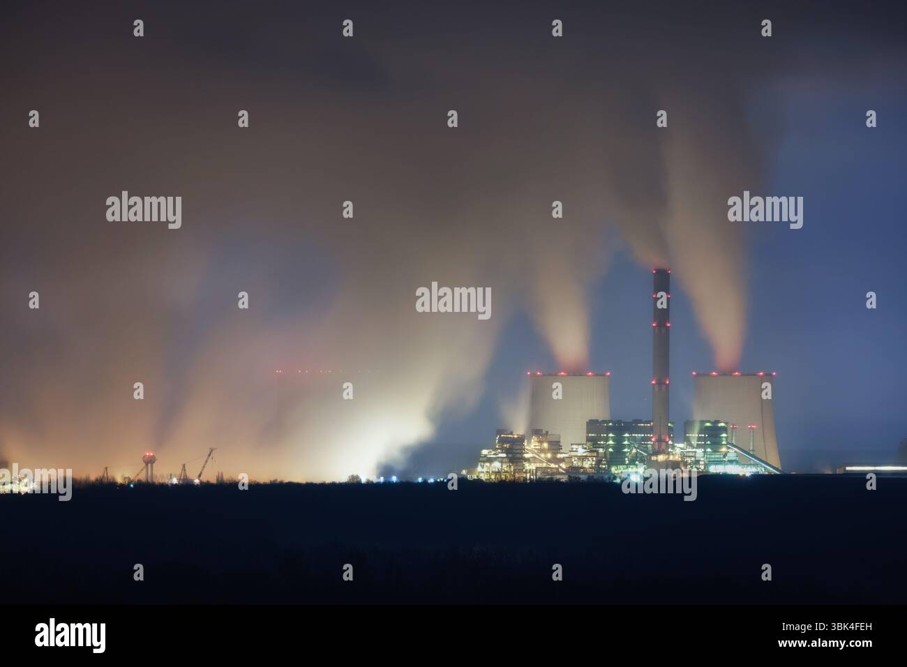 Huge and modern powerplant producing heat at night hi-res stock ...