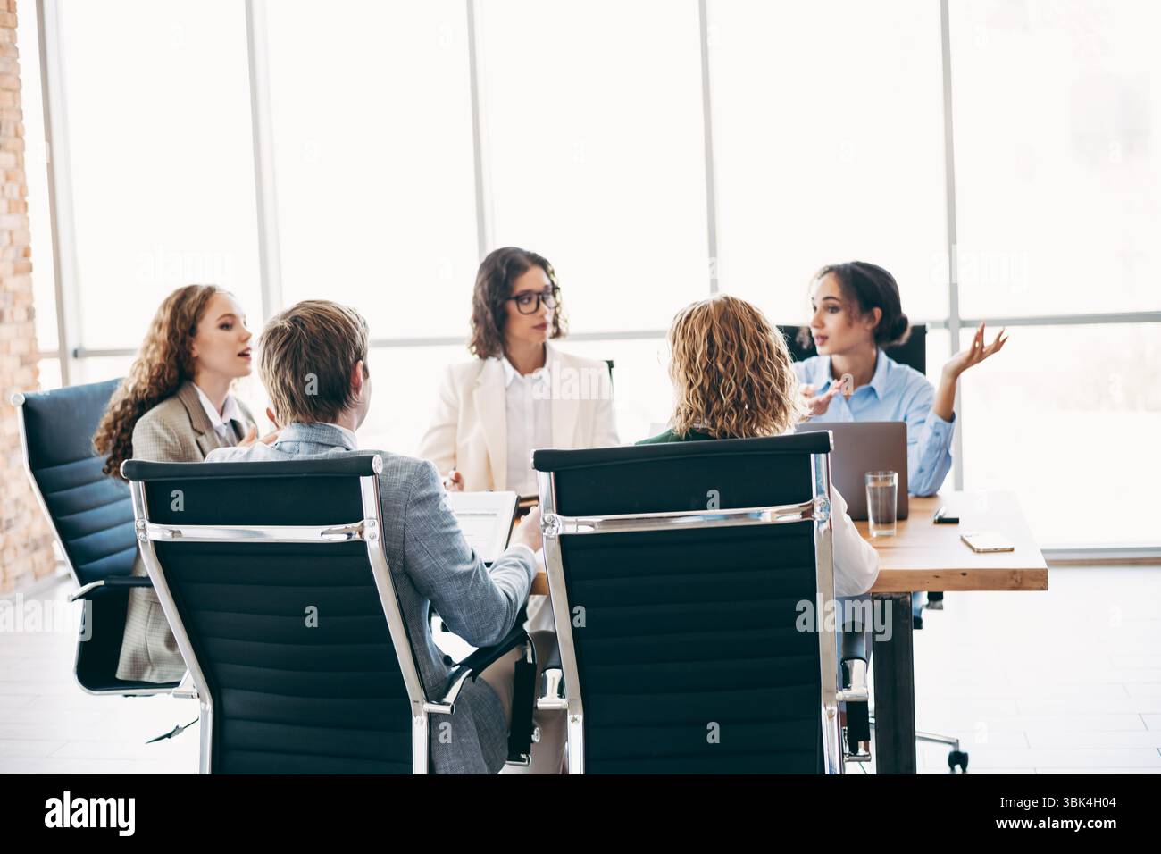 Diverse group of professionals collaborating around a meeting table in ...
