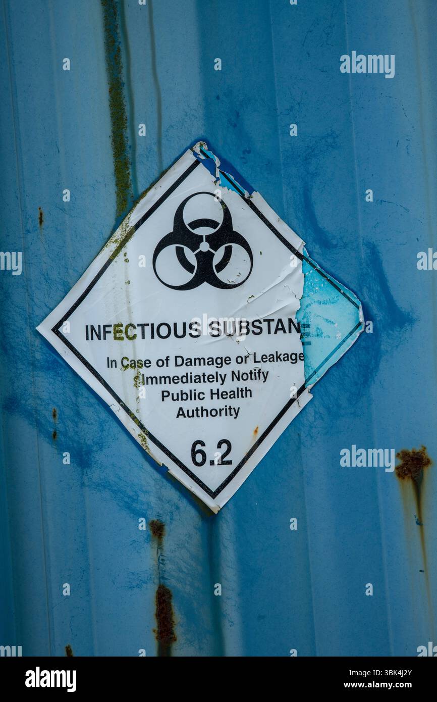 Weathered and peeling infectious substance sticker featuring a ...