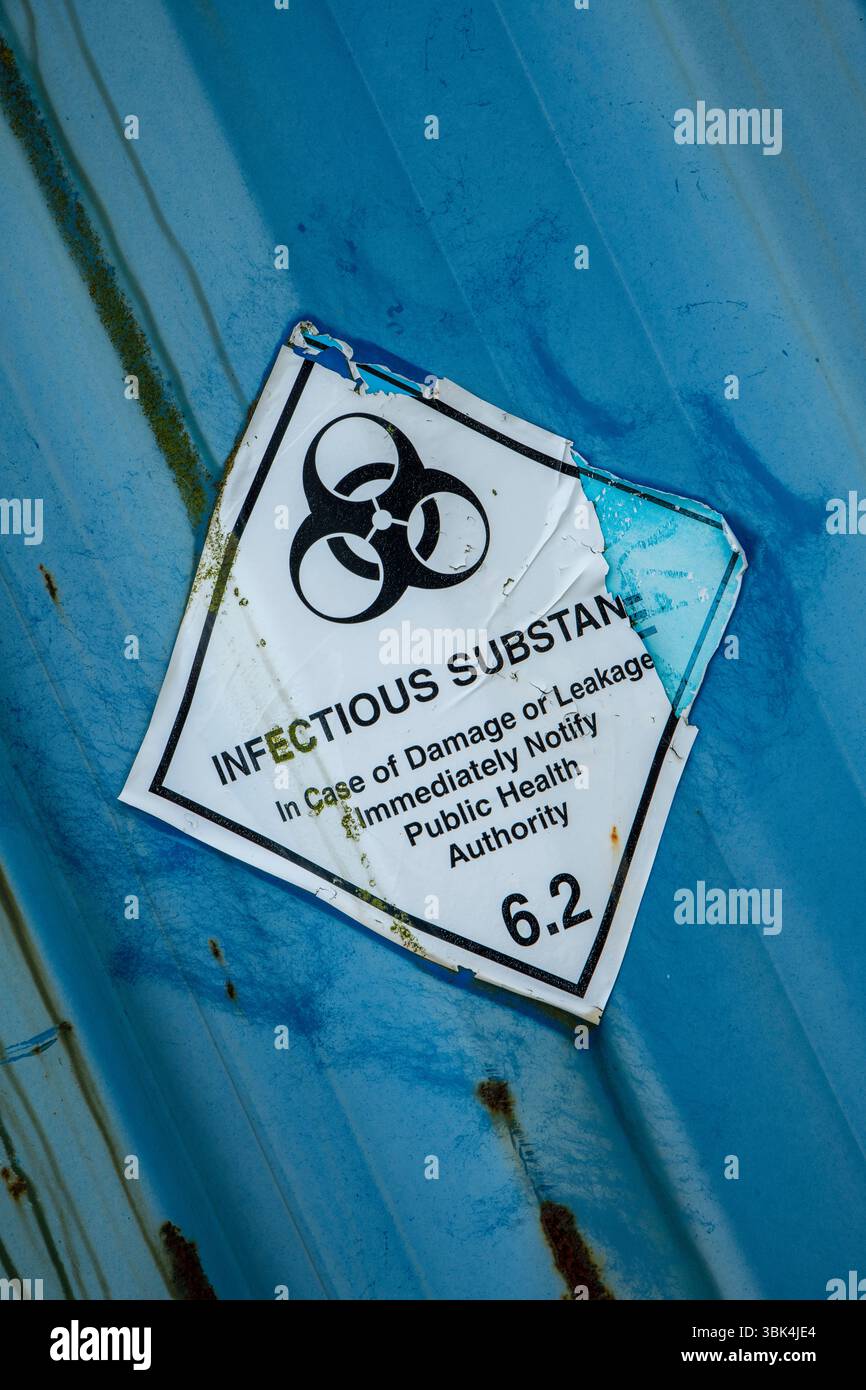 Weathered and peeling infectious substance sticker featuring a ...