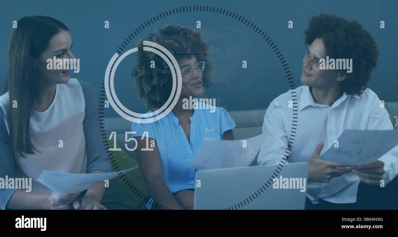 Three coworkers reviewing printed documents hi-res stock photography ...