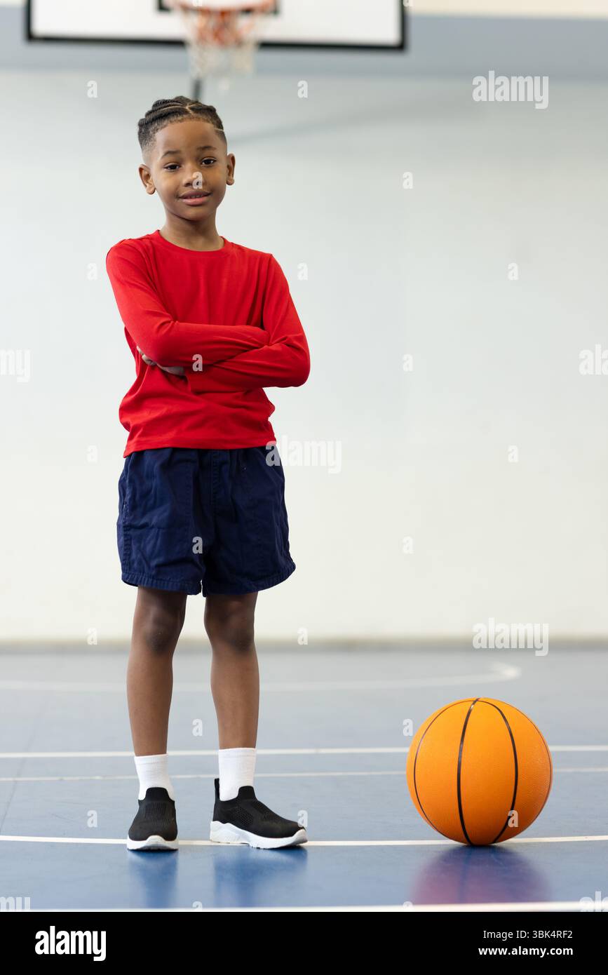 Boy standing on basketball court hi-res stock photography and images ...