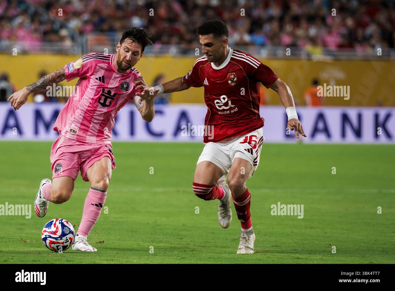 Lionel Messi of Inter Miami CF competes for the ball with Ahmed Koka of ...