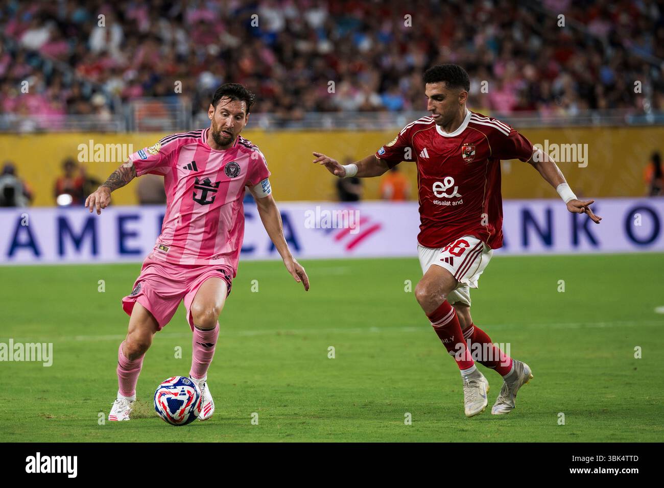 Lionel Messi of Inter Miami CF competes for the ball with Ahmed Koka of ...
