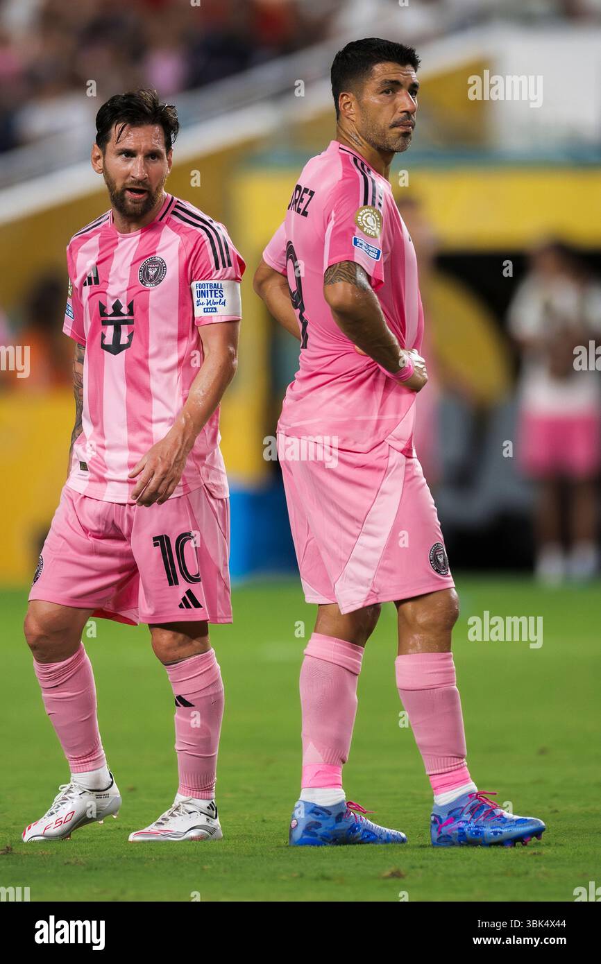 Lionel Messi of Inter Miami CF looks next to Luis Suarez of Inter Miami ...