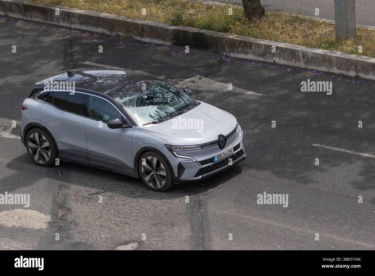 Modern electric car driving on asphalt road, seen from above Stock ...