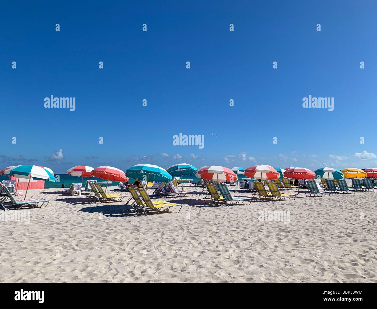 Colorful Beach Umbrellas and Lounge Chairs on Sunny Miami Beach with ...
