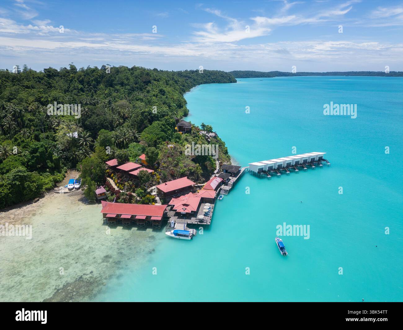 Maratua, Indonesia: Aerial view of a seafront resort with overwater bungalows in the Maratua ...