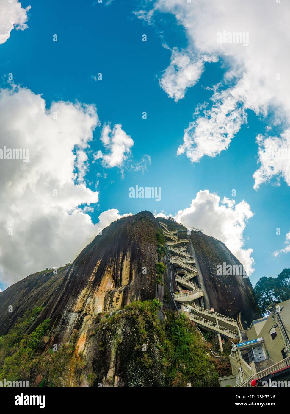 Stunning view of Peñol Rock in Guatape, Antioquia, under a bright blue ...