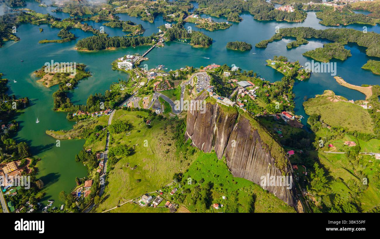 Stunning aerial view of the iconic Peñol Stone surrounded by lush ...