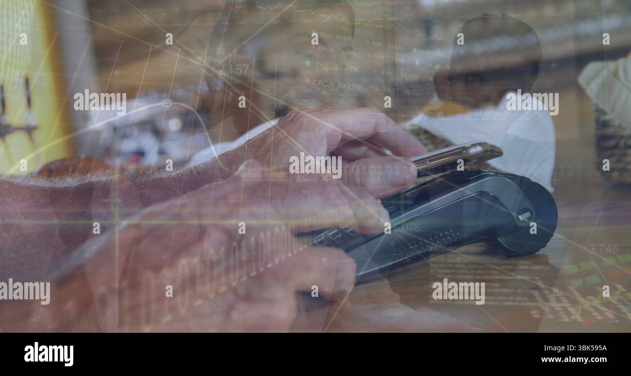 Holding smartphone above contactless reader at wooden cafe counter ...