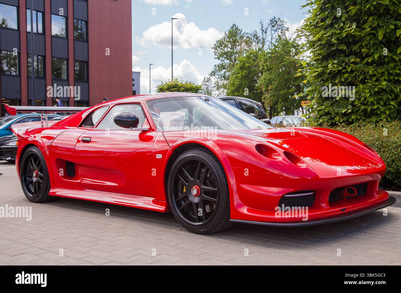 Vilnius, Lithuania - 31-05-2025 - Red Noble M12 sports car parked on a ...