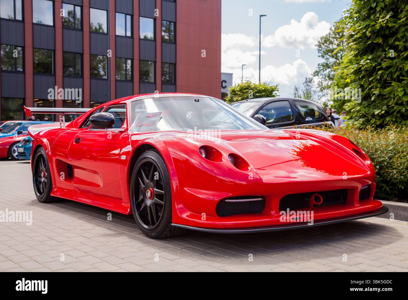 Vilnius, Lithuania - 31-05-2025 - Red Noble M12 sports car parked on a ...