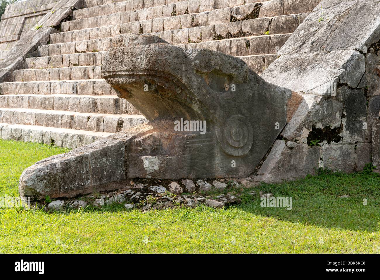 El Castillo Kukulcan Pyramid carved serpent head sculpture at base of ...