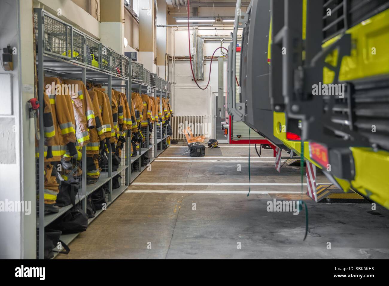 Firestation interior with vechicle and hanging cloth angle shot Stock ...