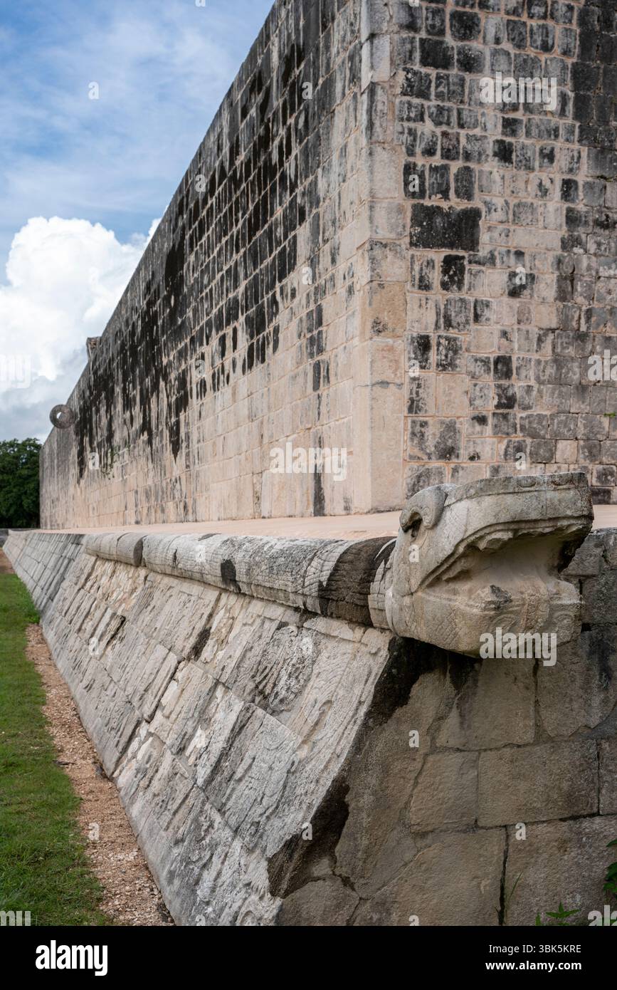Mayan Ball Court high stone walls with feathered serpent carved reliefs ...