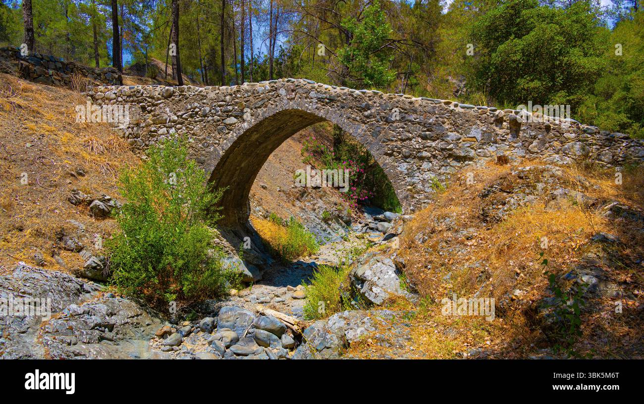 Old stone venetian bridge Elias in forest mountains in Cyprus Stock ...