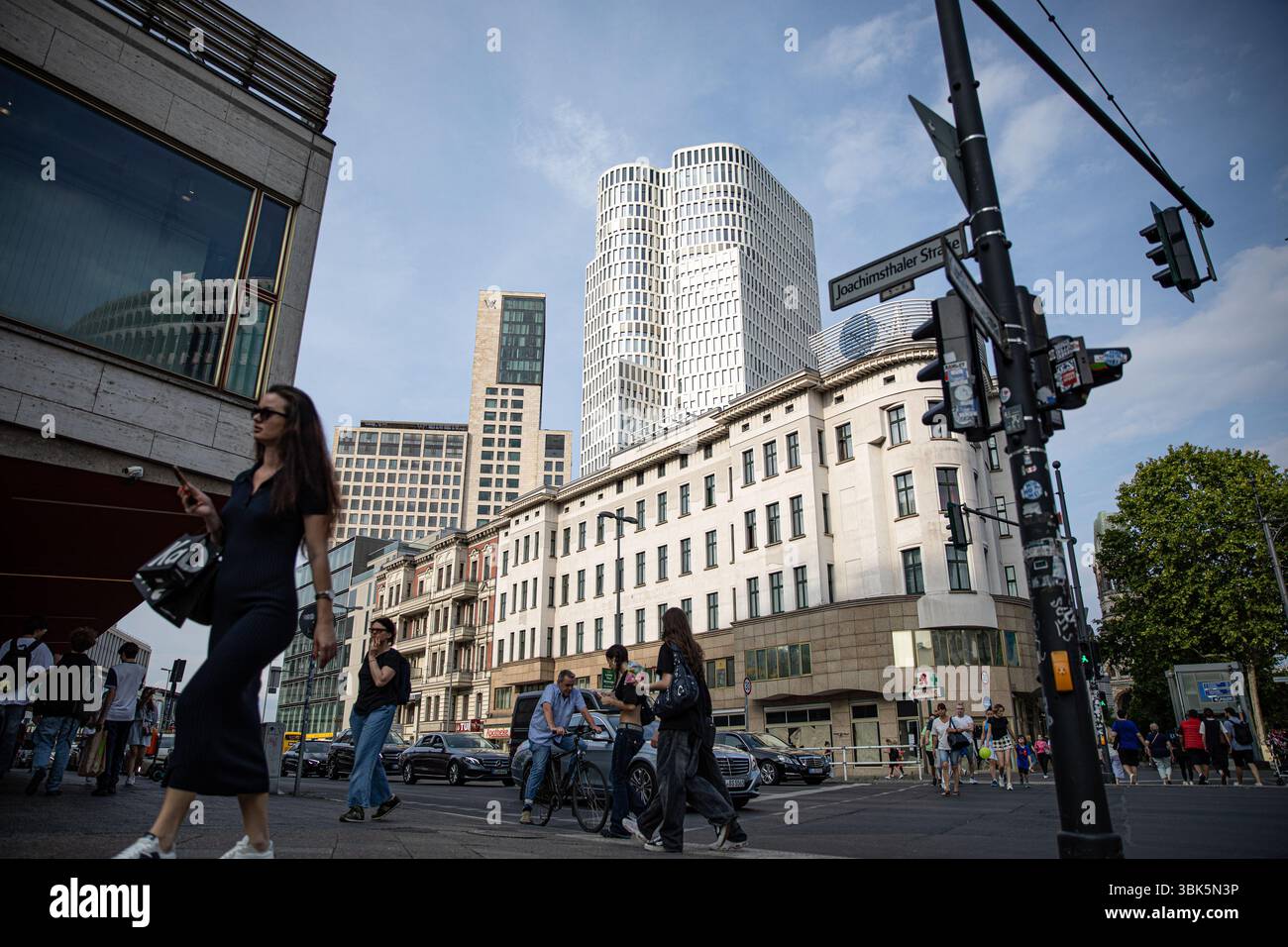 Pedestrians, shoppers, and tourists filled the streets of Berlin's ...