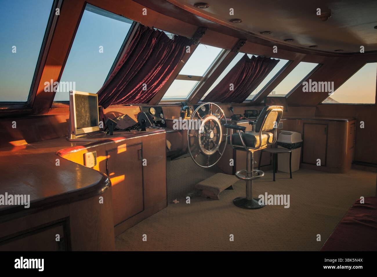 Cockpit of boat in sunlight angle shot Stock Photo - Alamy