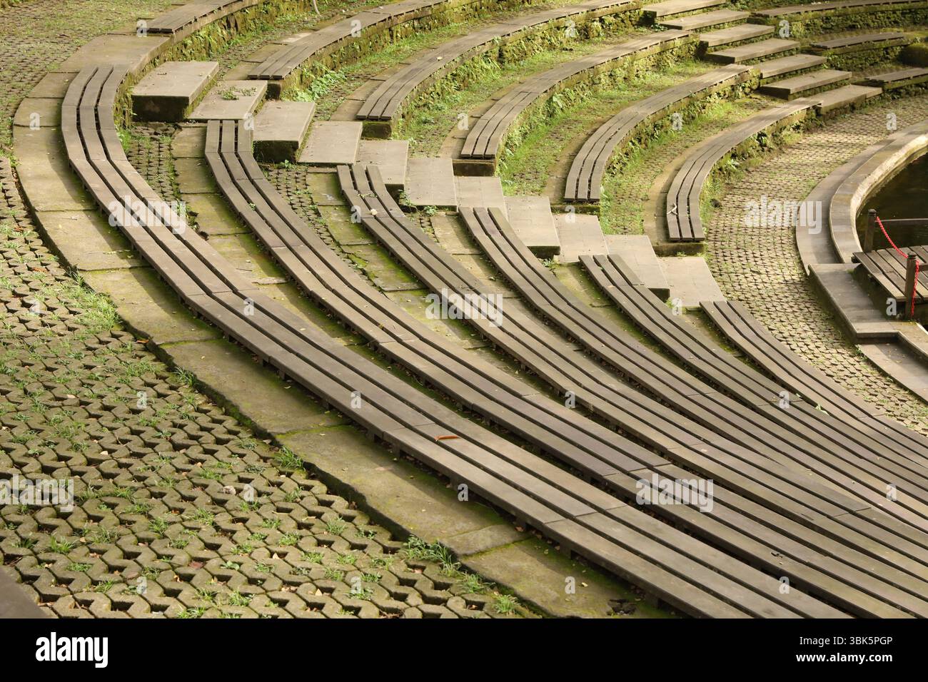Wooden amphitheater seating and concrete steps outdoors Stock Photo - Alamy