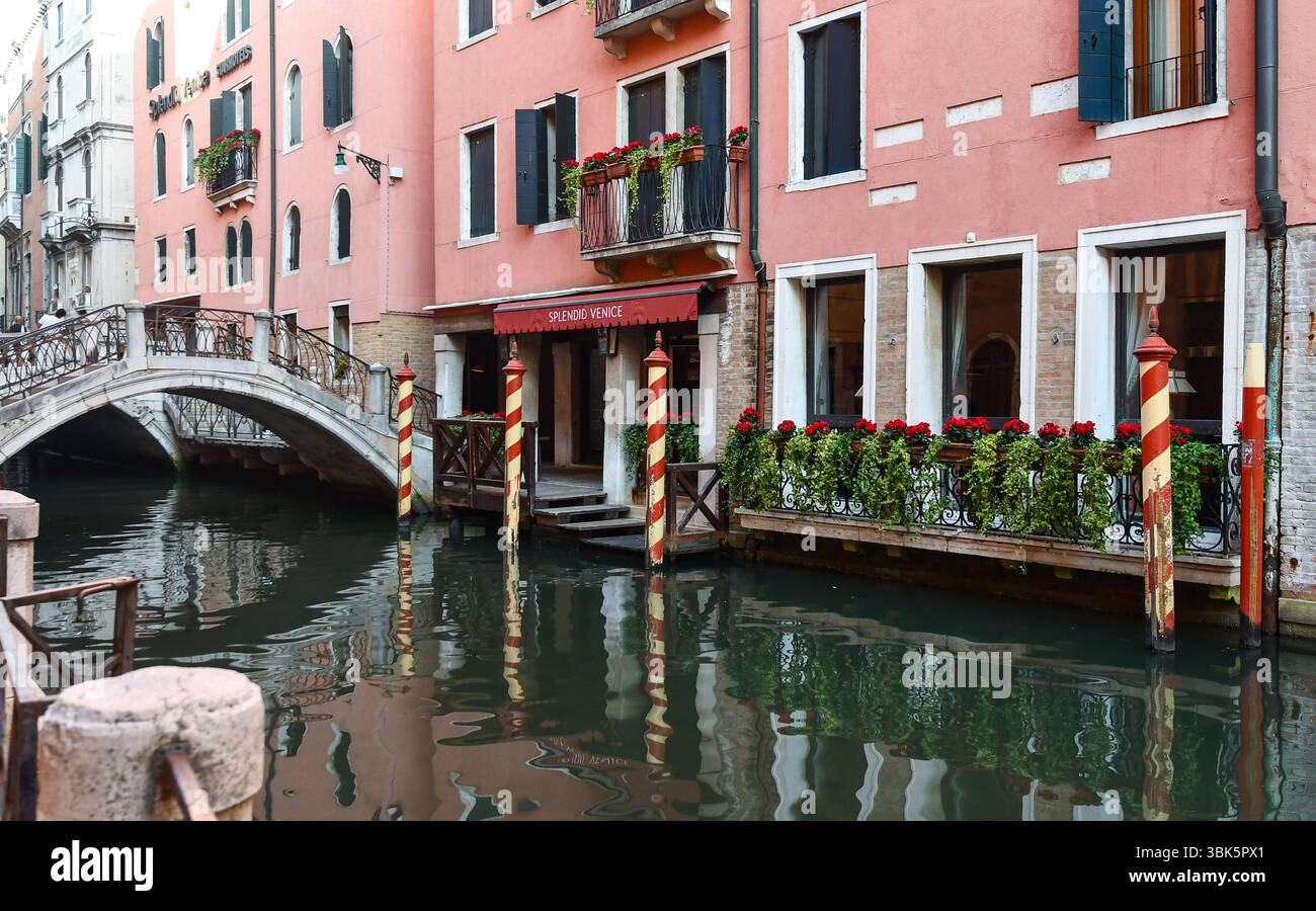 A glimpse of Rio dei Bareteri canal, with the arch bridge of the same ...