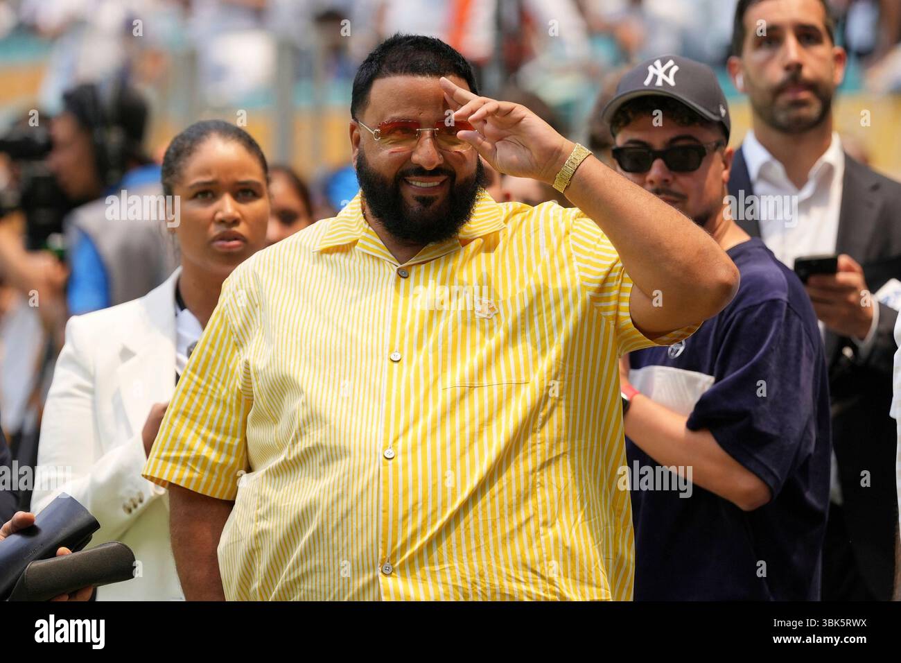 DJ Khaled acknowledges fans as he arrives for the Club World Cup group ...