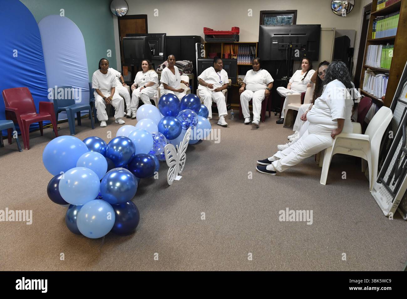 Women in a Texas prison prepare for a graduation ceremony from a multi ...