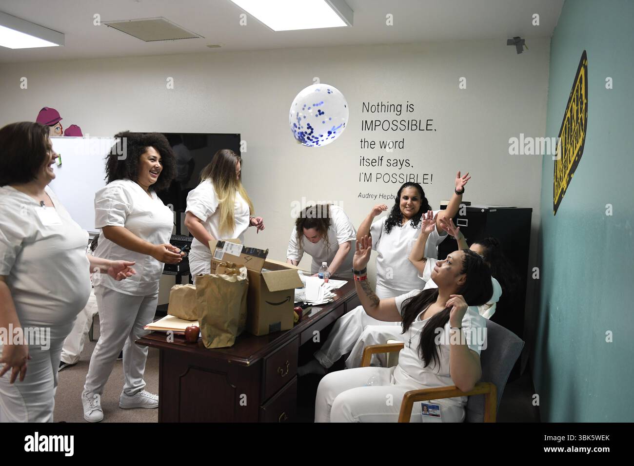 Women in a Texas prison prepare for a graduation ceremony from a multi ...