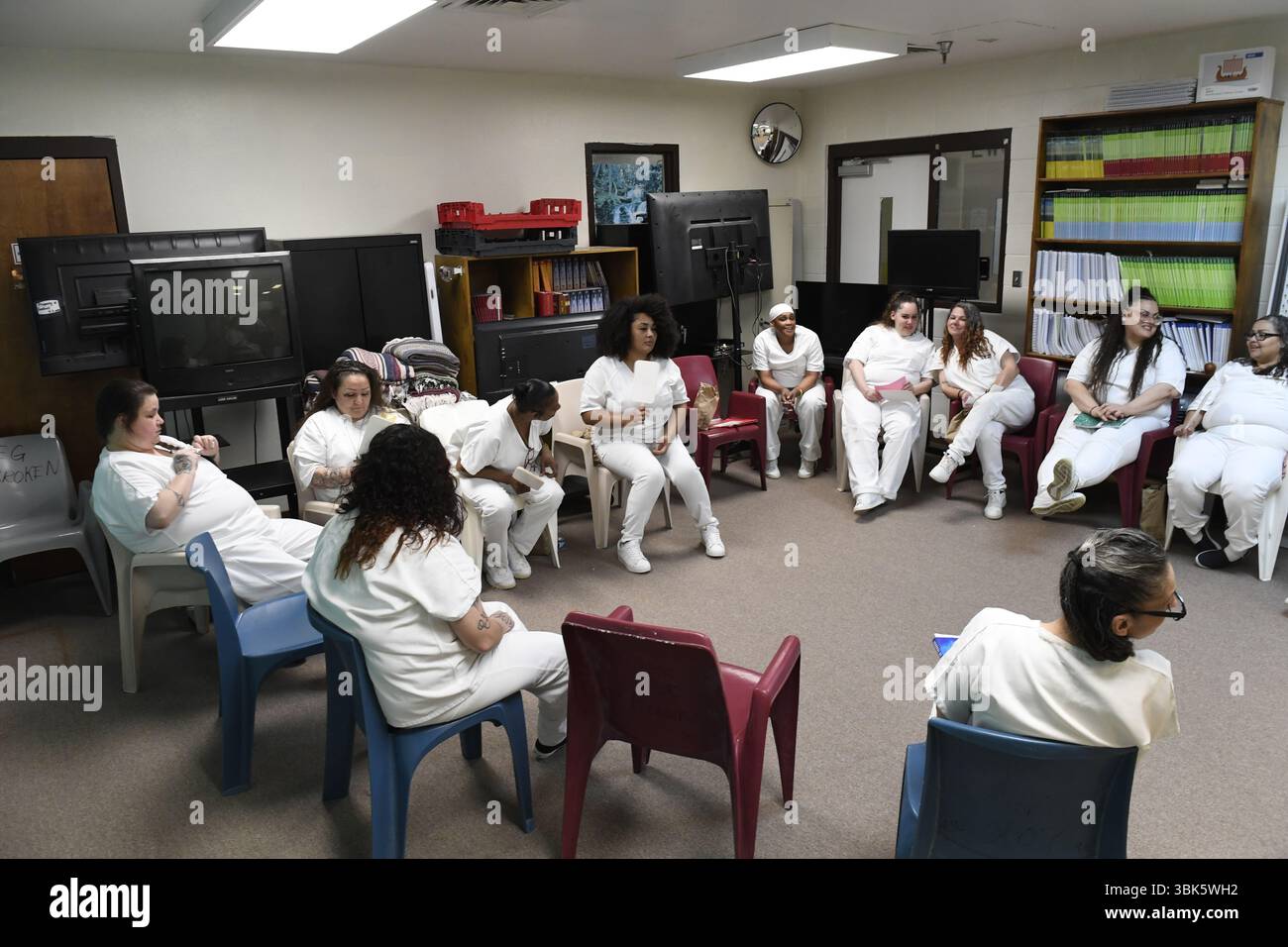 Women in a Texas prison prepare for a graduation ceremony from a multi ...