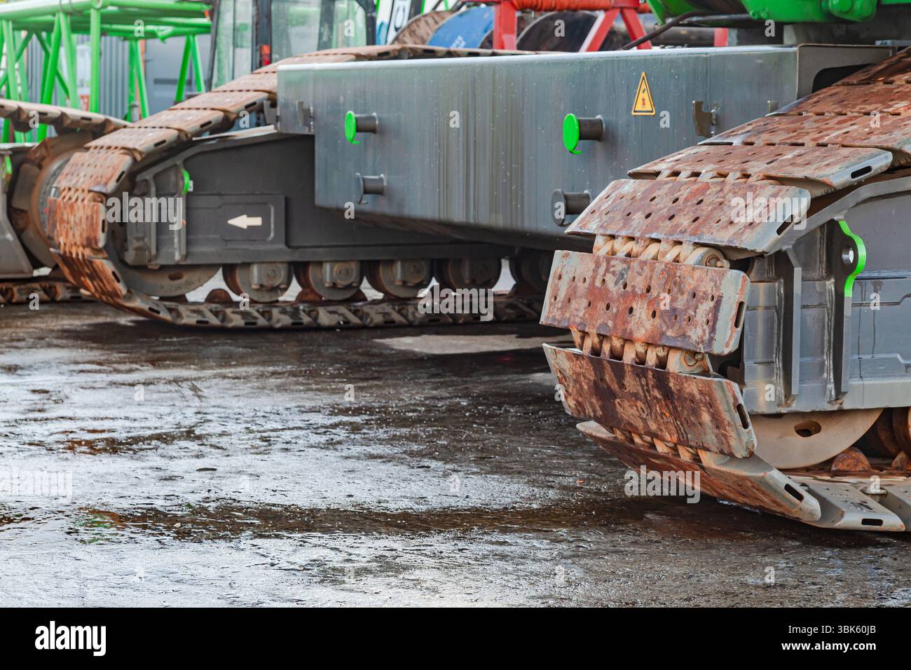 Metal tracks of a crawler cranes with steel wheels. Chassis tracked ...