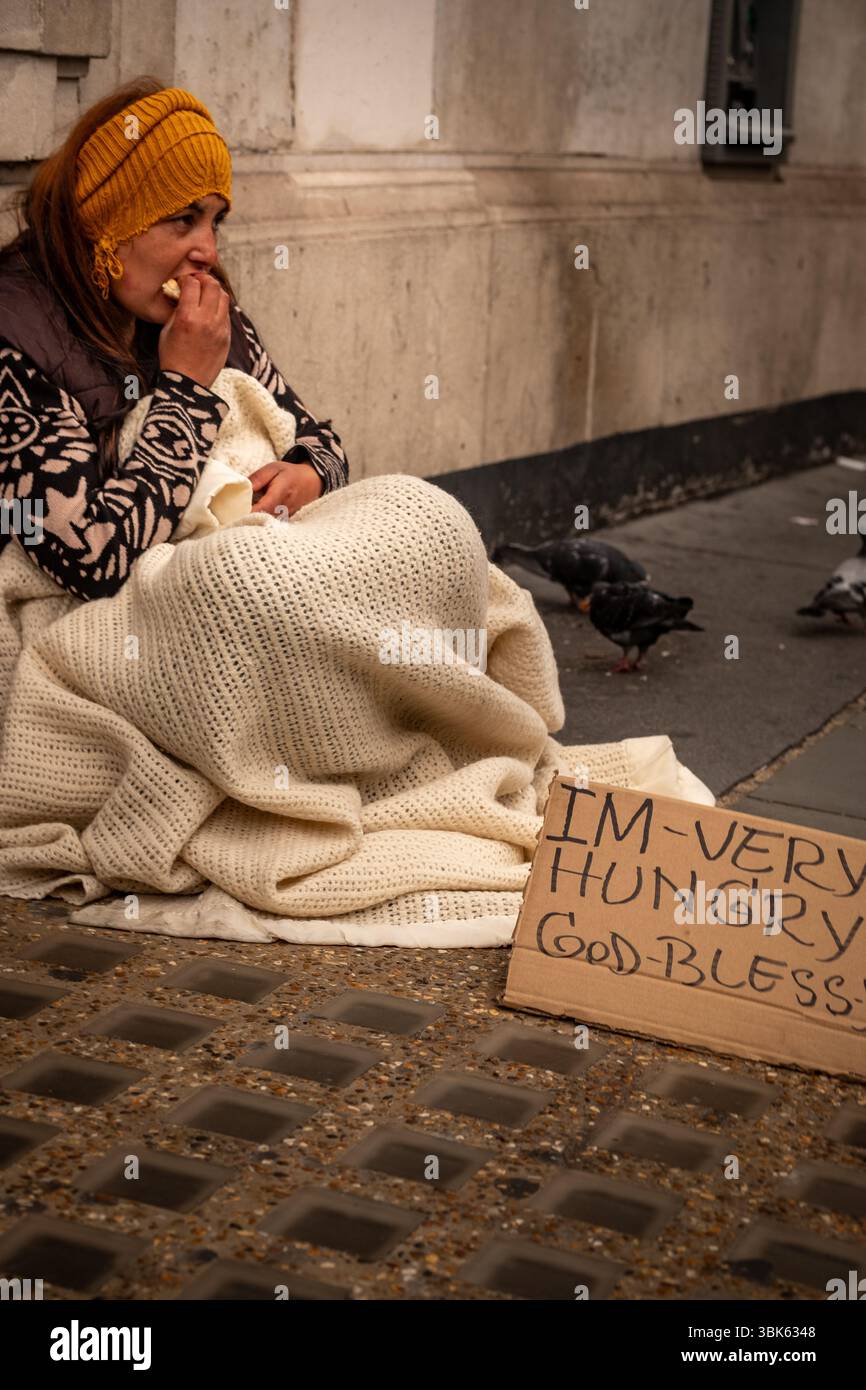 LONDON- MAY 22, 2025: A homeless person sits begging on Oxford Street ...