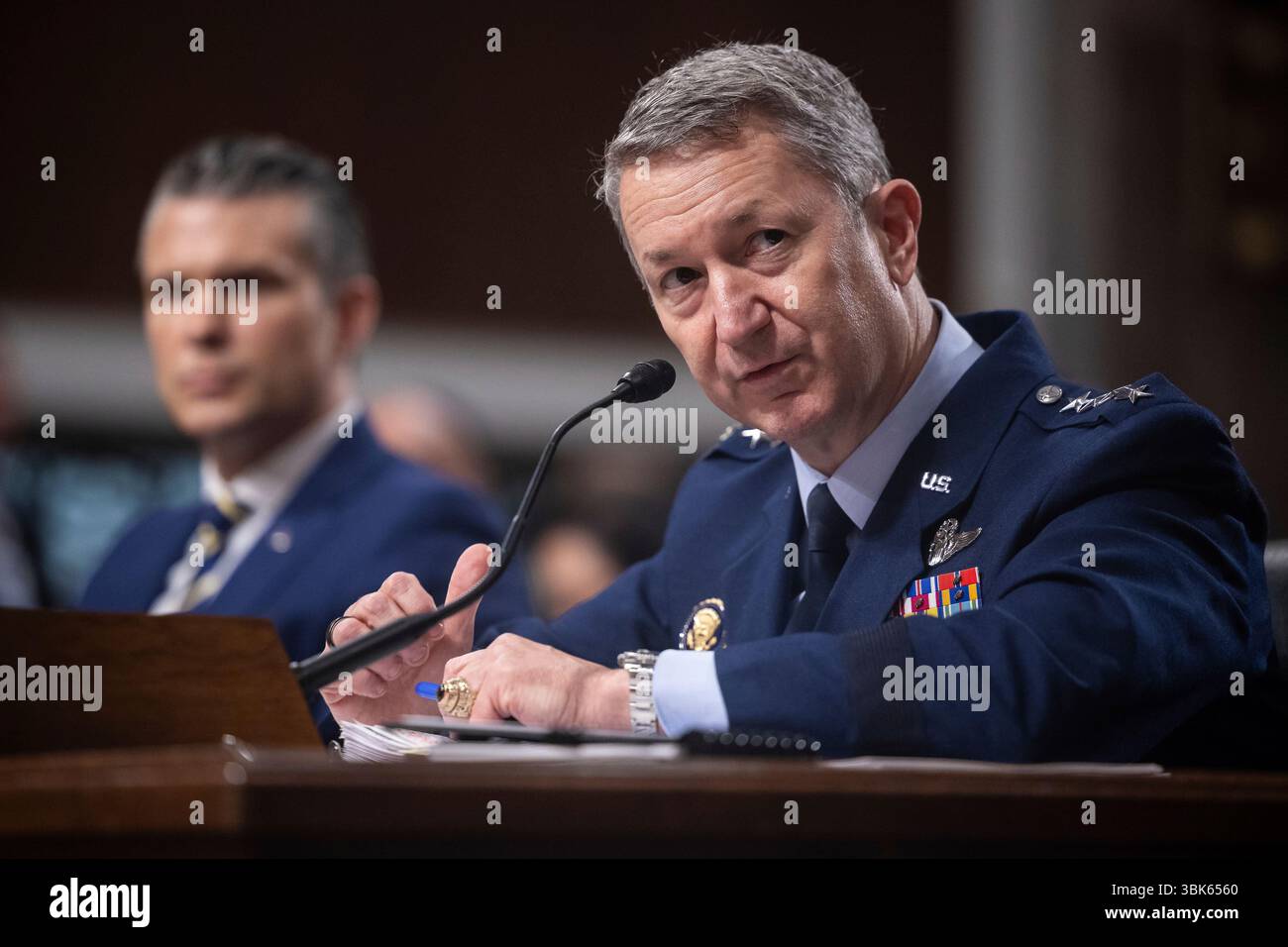 Chairman of the Joint Chiefs of Staff Dan Caine, right, and Defense ...