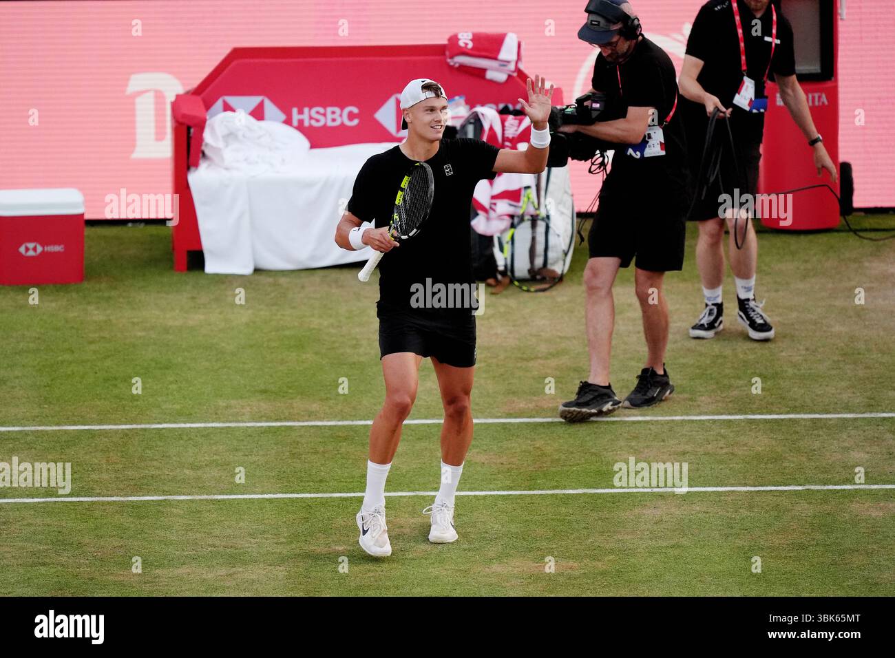 Holger Rune celebrates winning his match against Mackenzie McDonald on ...
