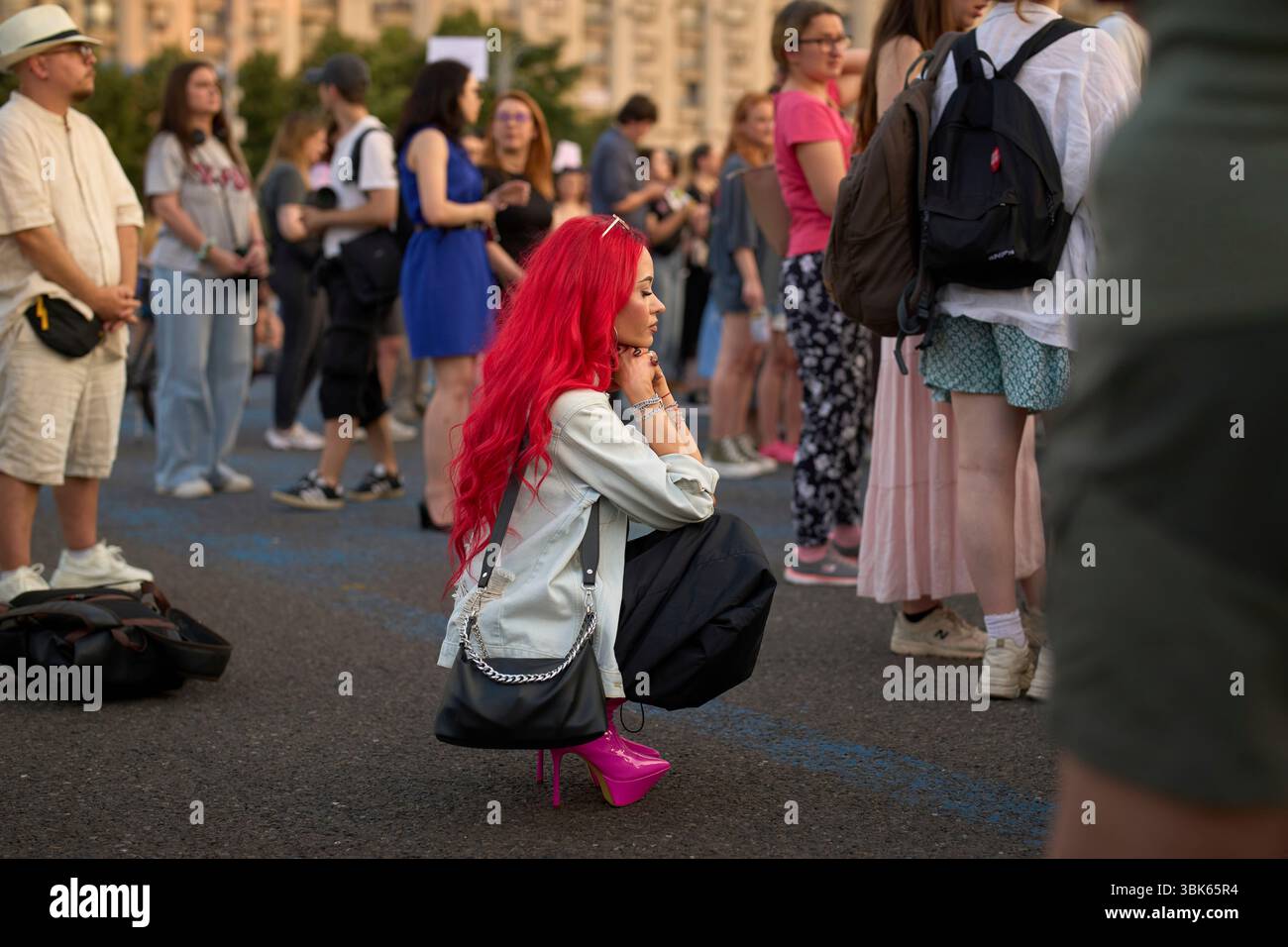 A woman pauses during a protest outside the government headquarters in ...
