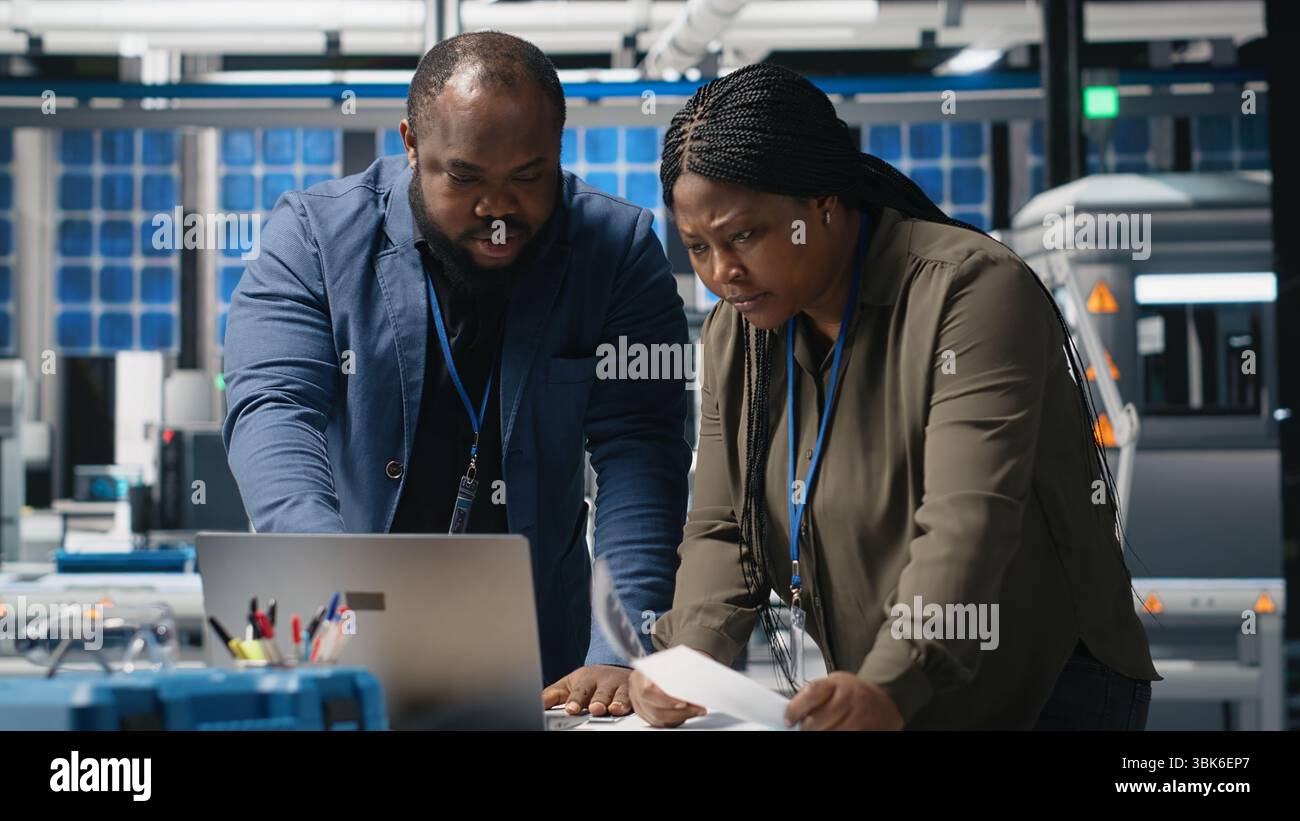 African american inspectors supervisors engaging in briefing over ...