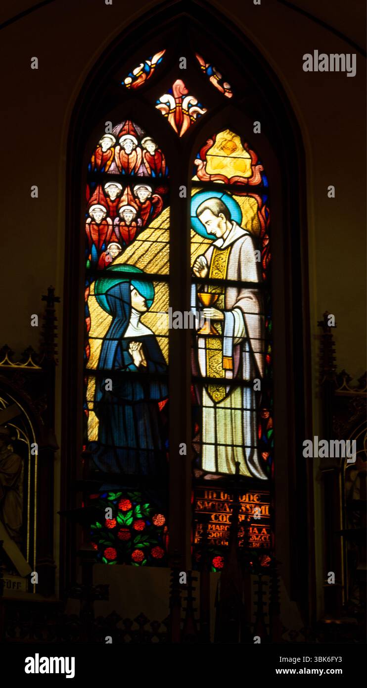 Stained Glass Window of A Priest giving Holy Communion to a Nun in St ...