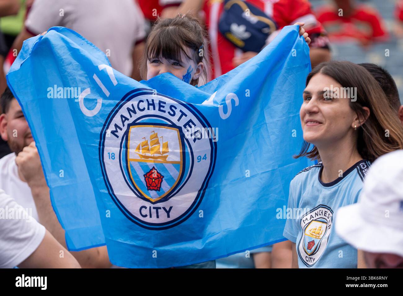 A Manchester City fan looks on with her flag during the Club World Cup ...