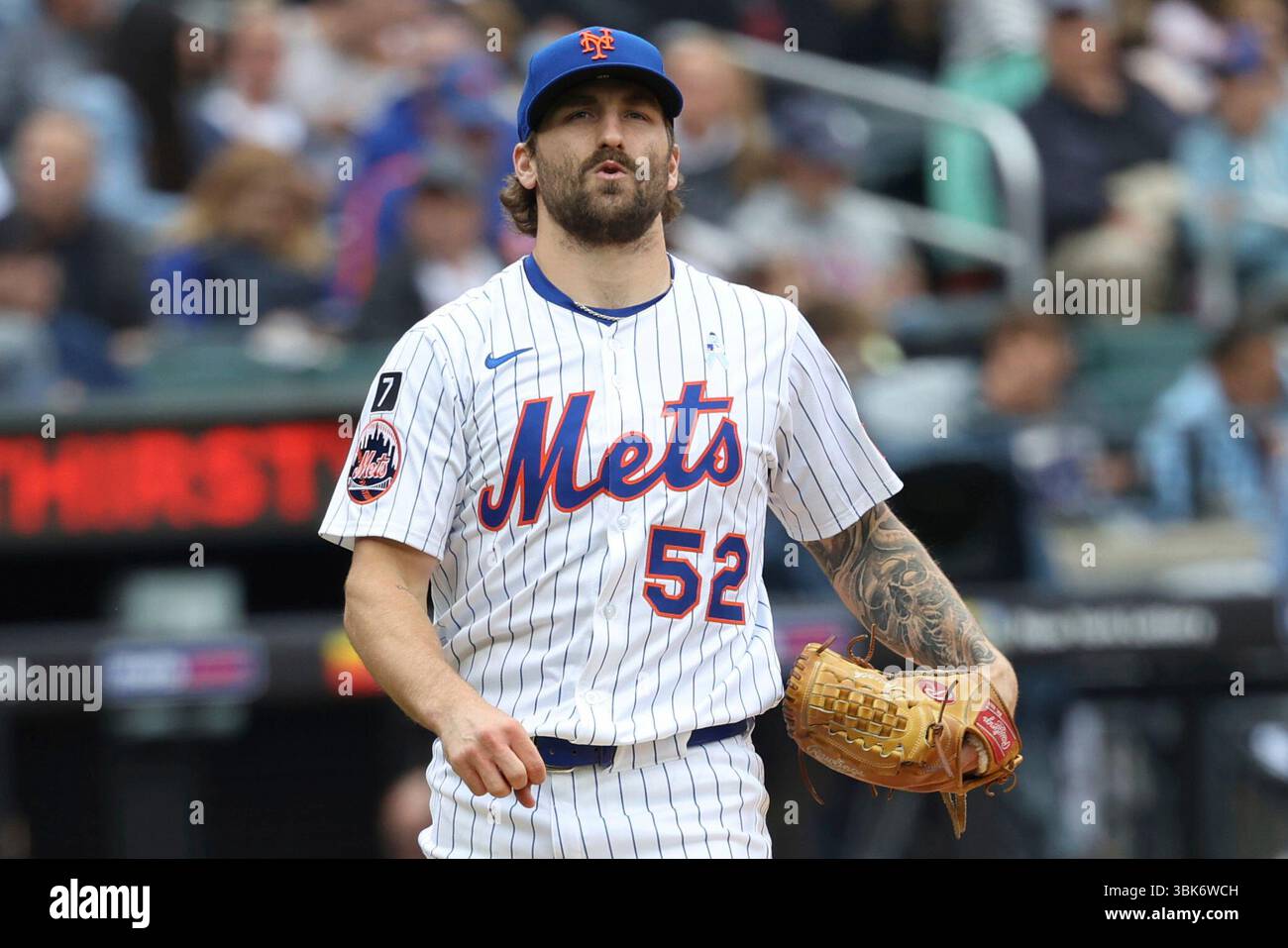 New York Mets' Ty Adcock stands on the field during the seventh inning ...