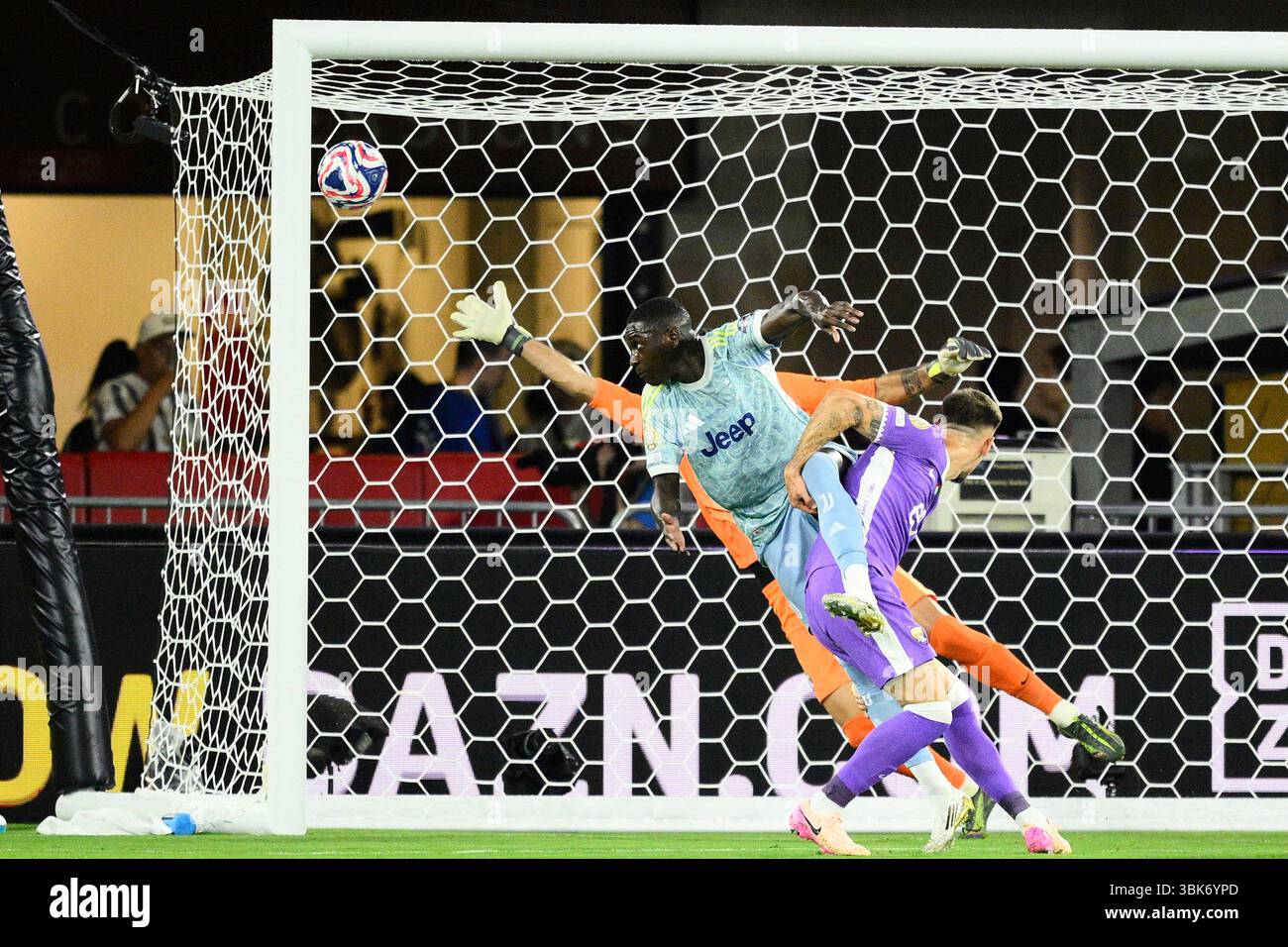 Juventus' Randal Kolo Muani, top, heads the ball to score his team's ...