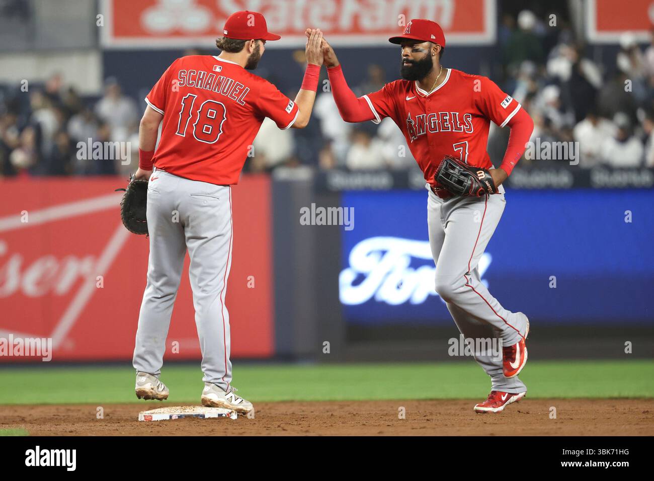 Los Angeles Angels' Nolan Schanuel, left, and Jo Adell, right, react ...