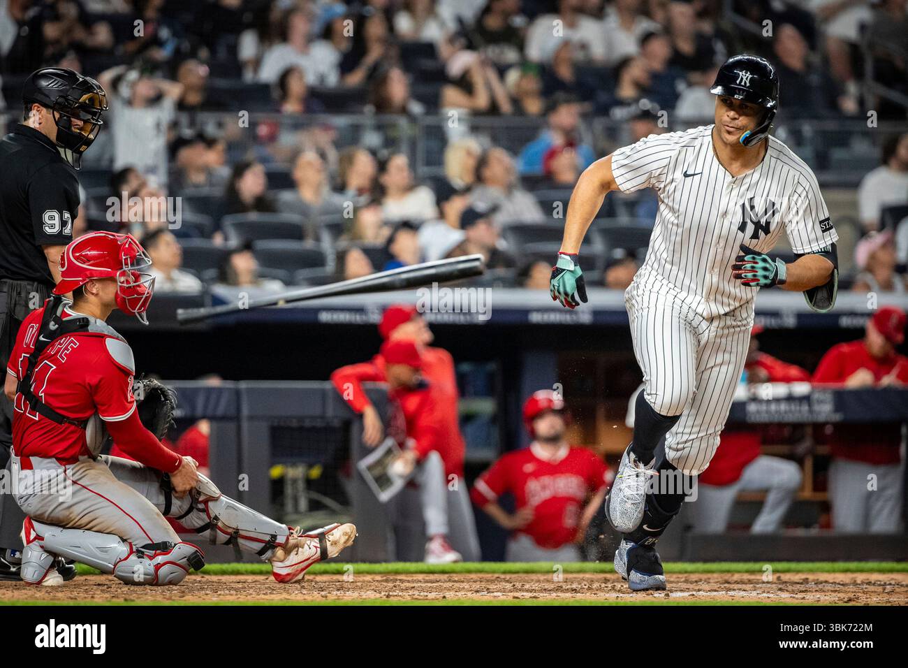 New York Yankees' Giancarlo Stanton (27) ditches his bat as he flies ...