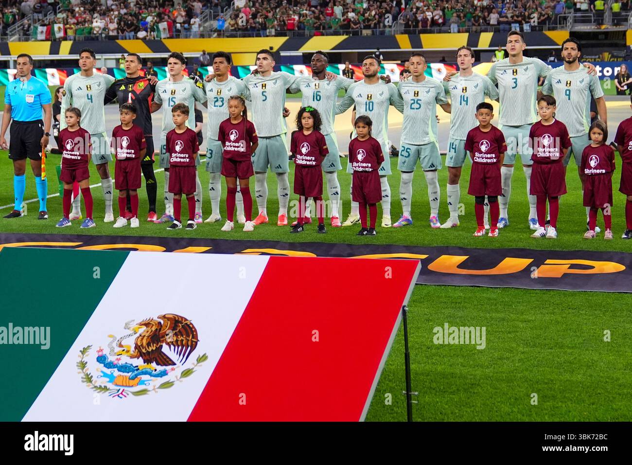 Mexico players stand for the playing of their national anthem prior to ...