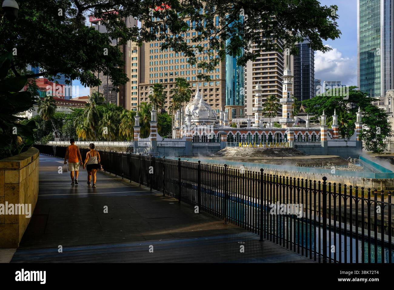 Kuala Lumpur, Malaysia. 22nd May, 2025. A couple of tourist enjoys ...