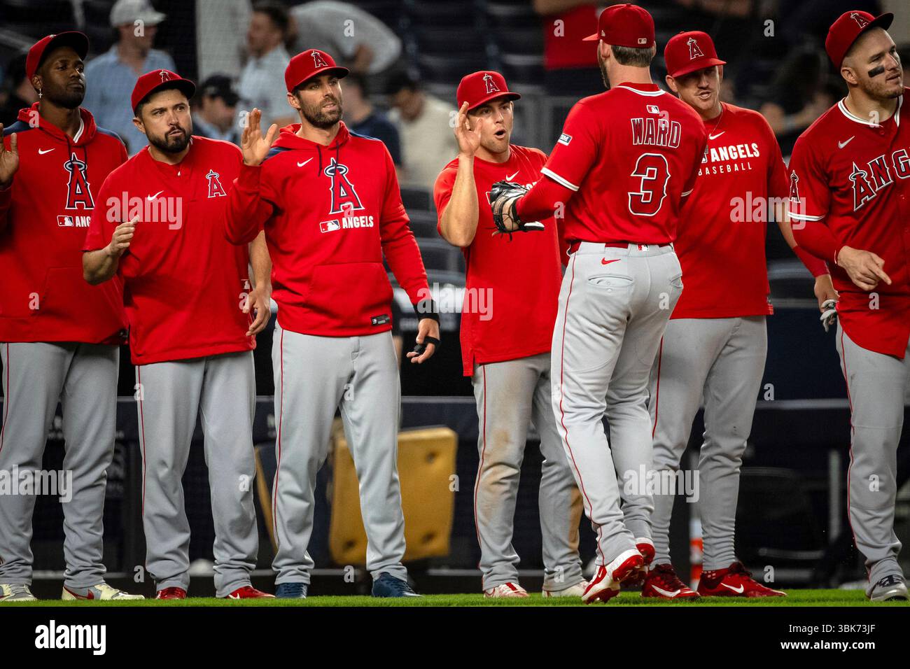Los Angeles Angels players congratulate each other after the team's win ...