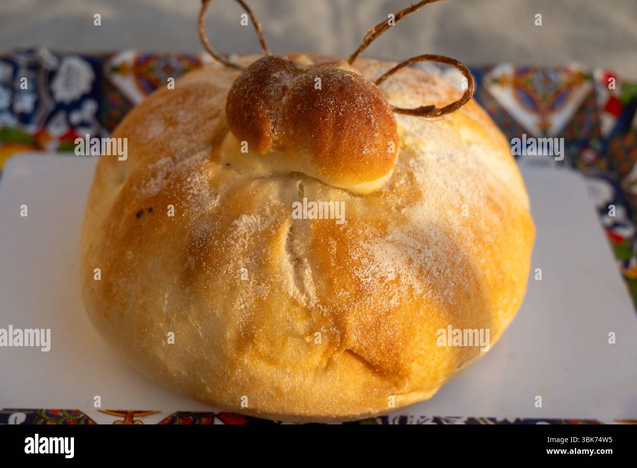 Fresh baked bread in burrata cheese shape filled with tomatoes ...
