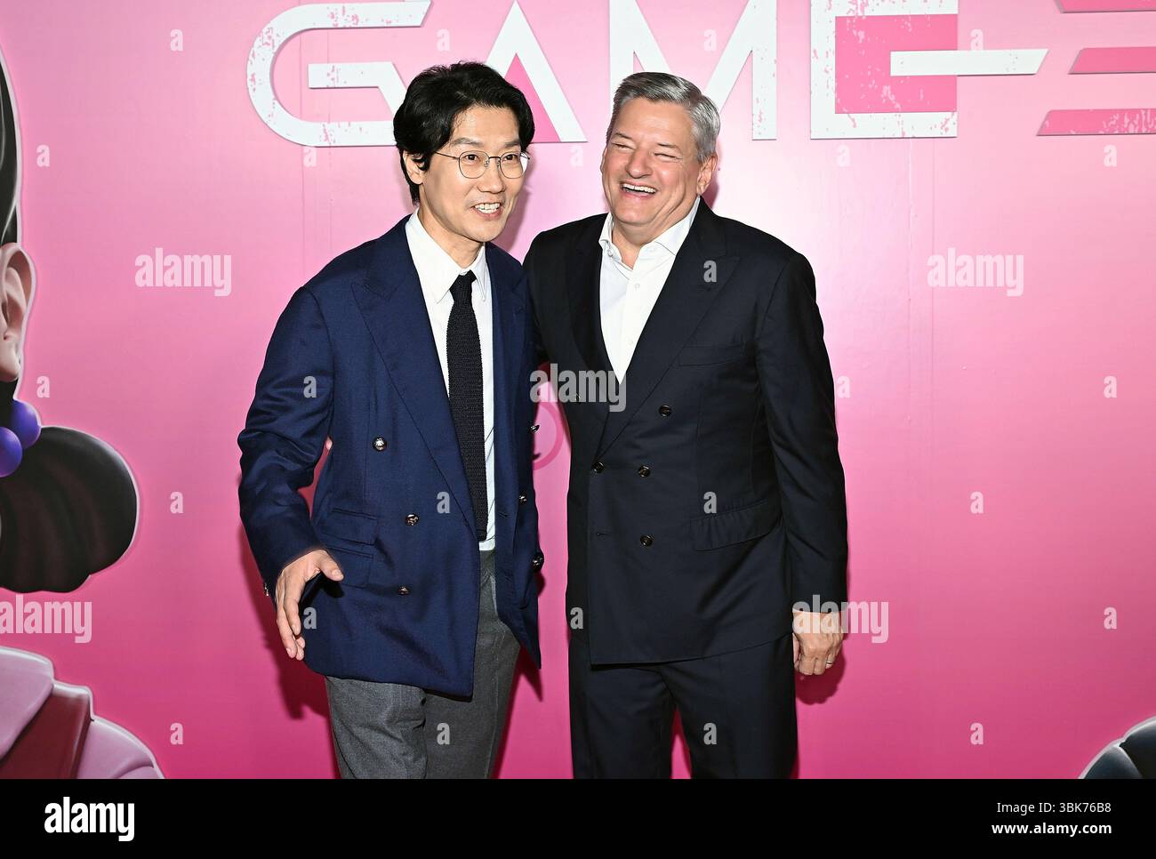 Director Hwang Dong-hyuk, left, and Netflix CEO Ted Sarandos attend the ...