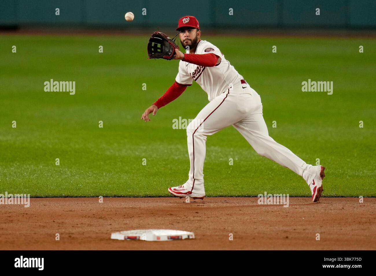 Washington Nationals second baseman Luis Garcia Jr. catches a ball hit ...