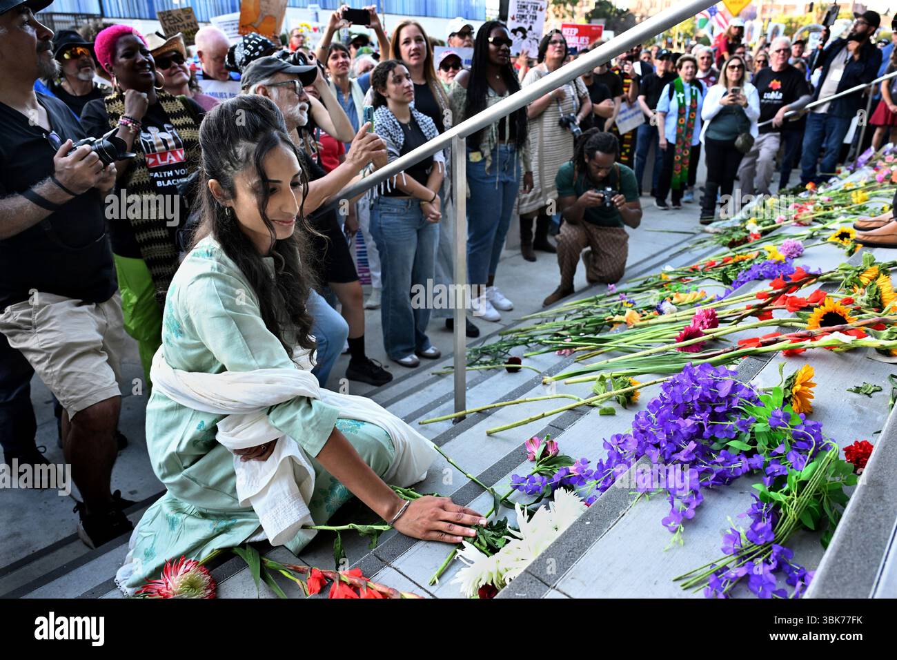 CORRECTS LAST NAME FROM SUMEKH TO KAUR - Valarie Kaur places a flower ...